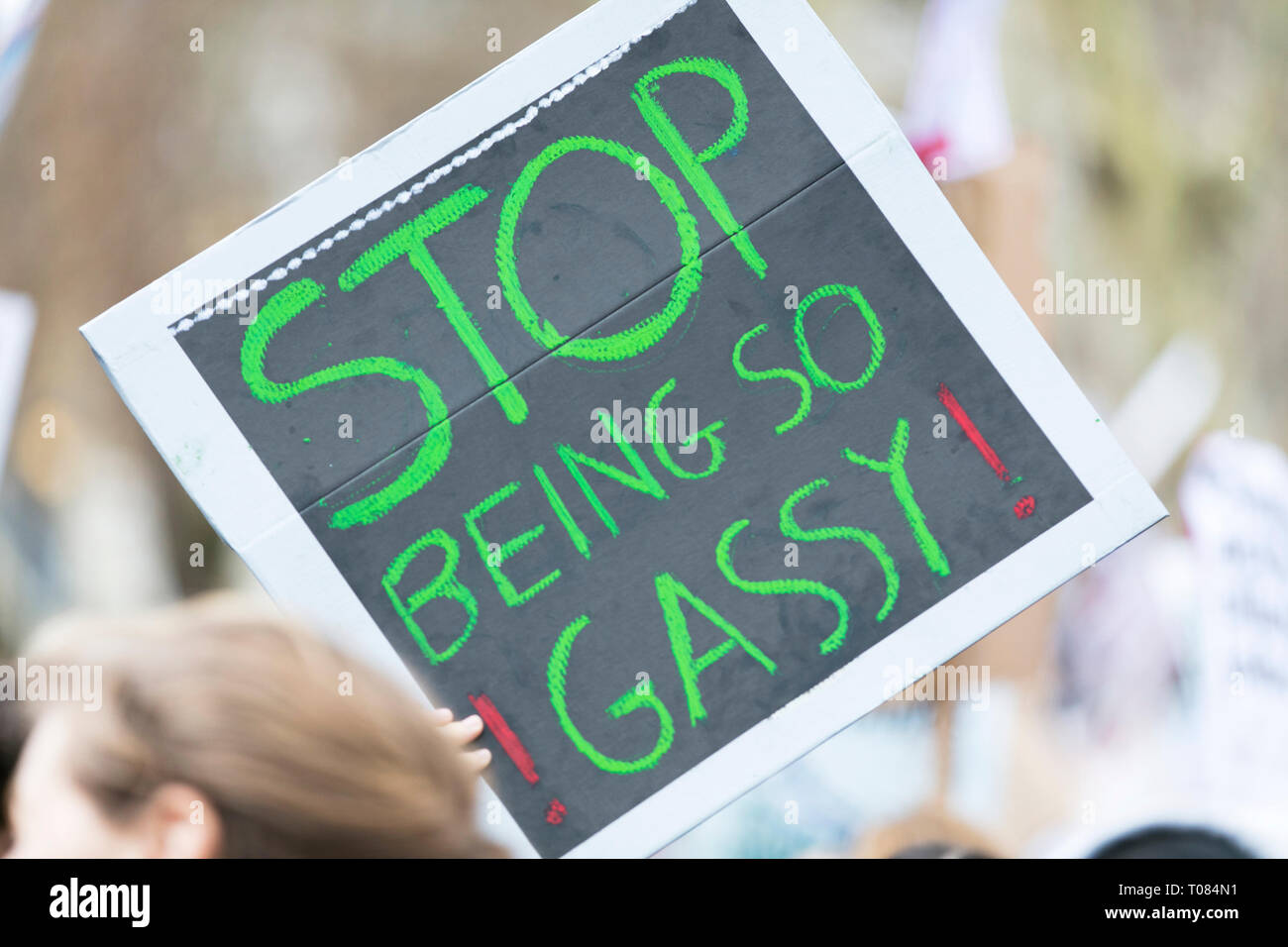 People with banners protest as part of a climate change march Stock ...