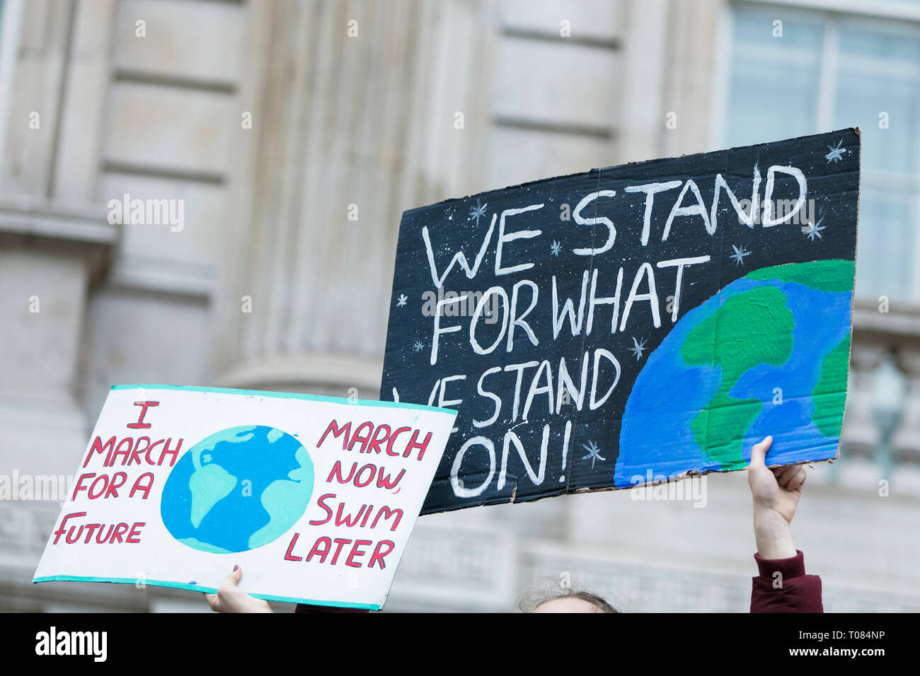 People with banners protest as part of a climate change march Stock ...