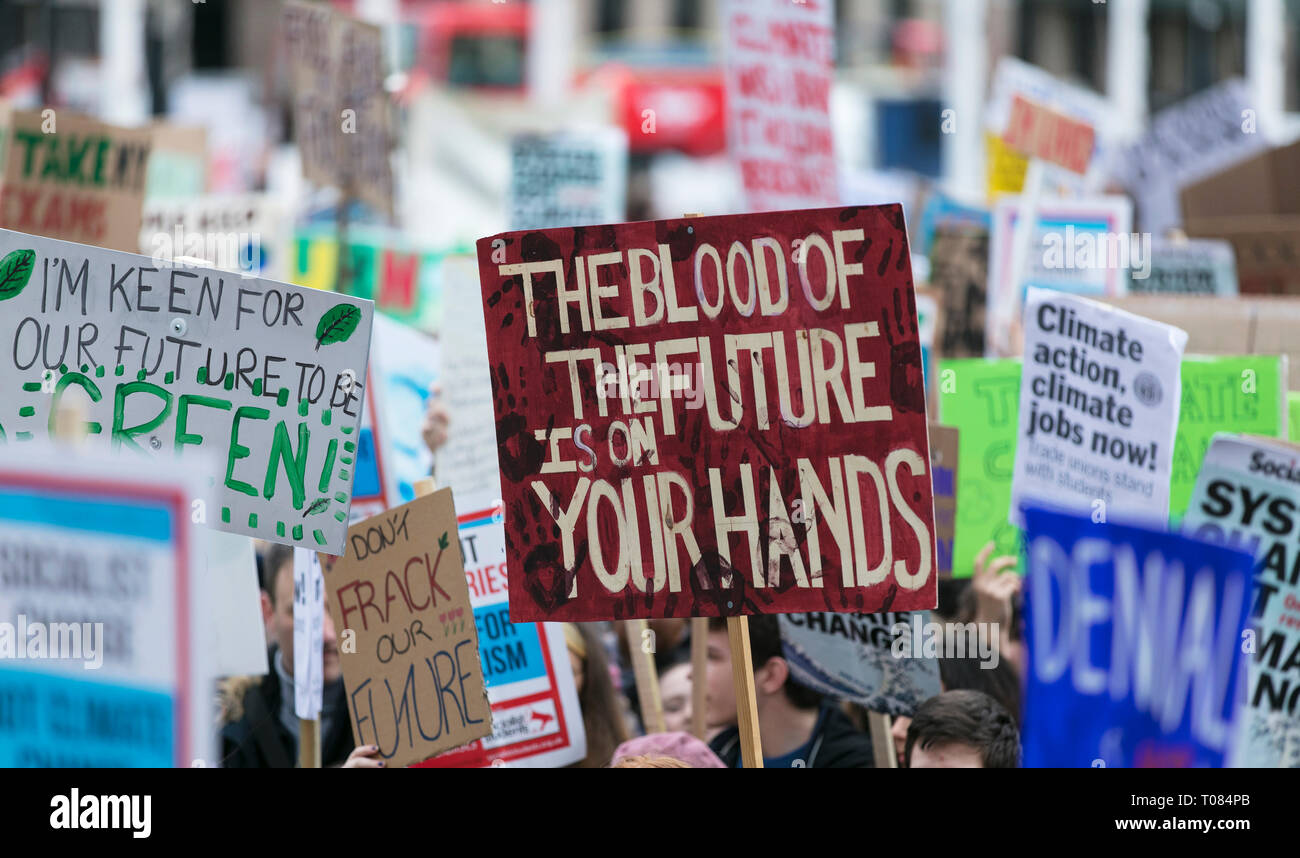 People with banners protest as part of a climate change march Stock ...