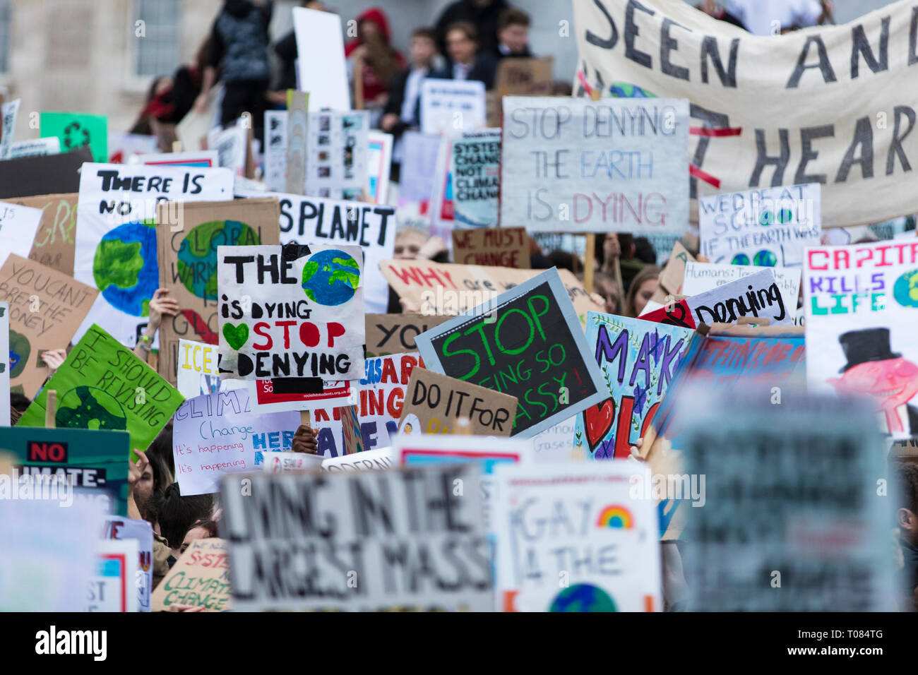 People with banners protest as part of a climate change march Stock ...