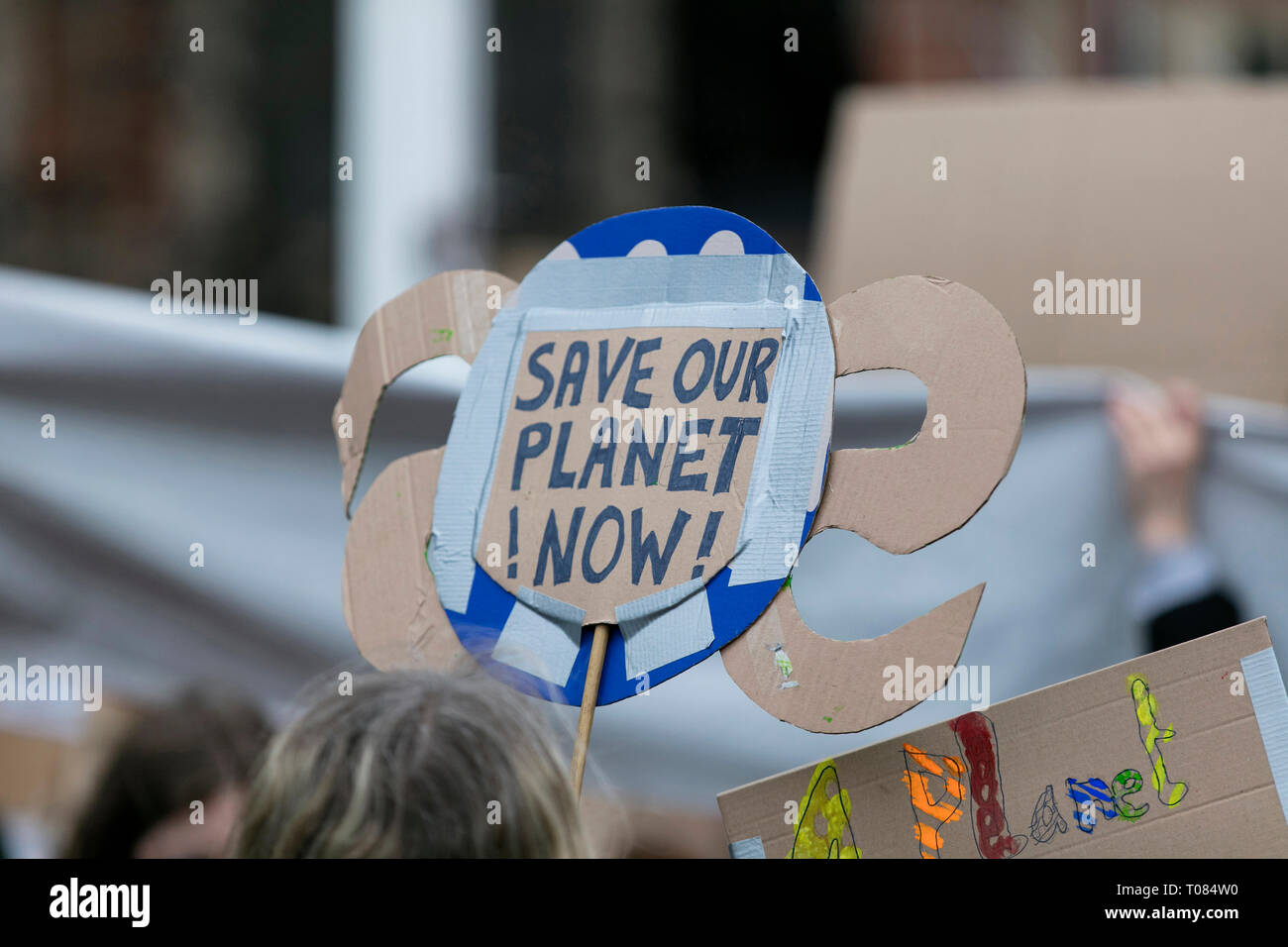 People with banners protest as part of a climate change march Stock ...