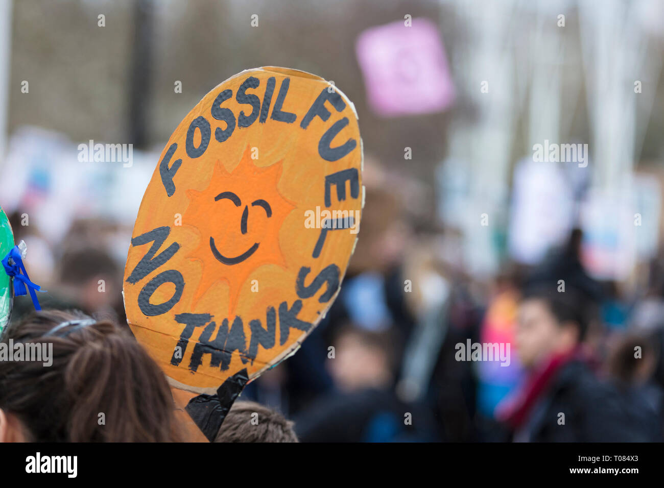 People with banners protest as part of a climate change march Stock ...