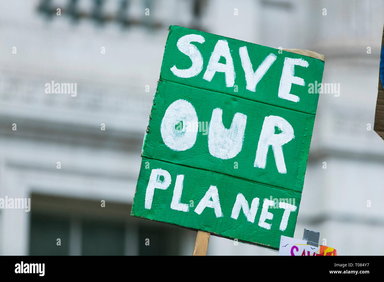 People with banners protest as part of a climate change march Stock ...