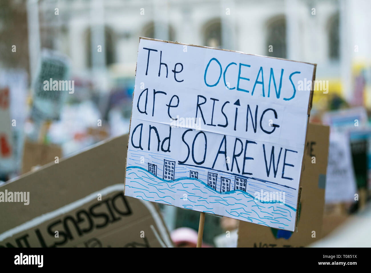 People with banners protest as part of a climate change march Stock ...