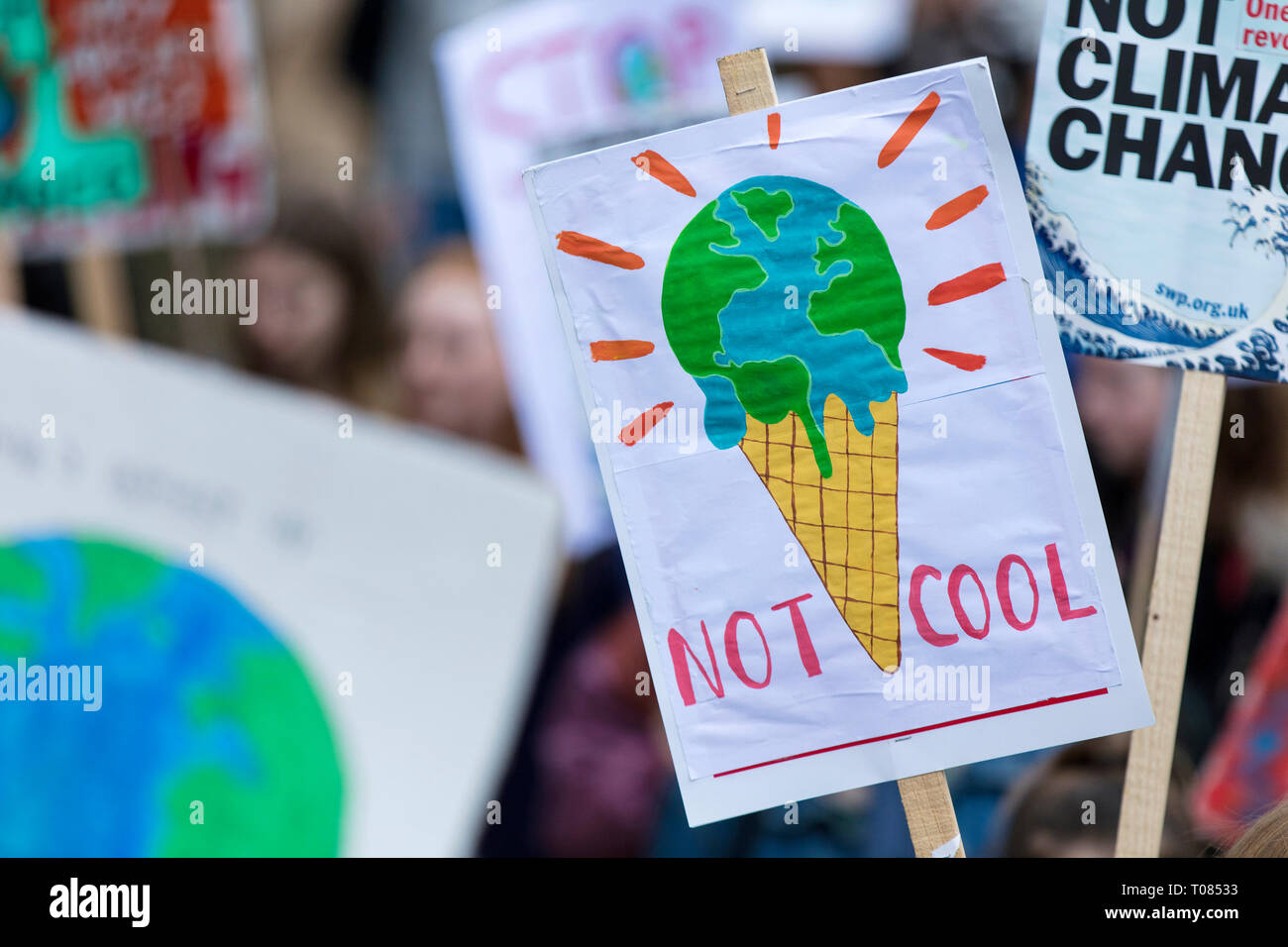 People with banners protest as part of a climate change march Stock ...