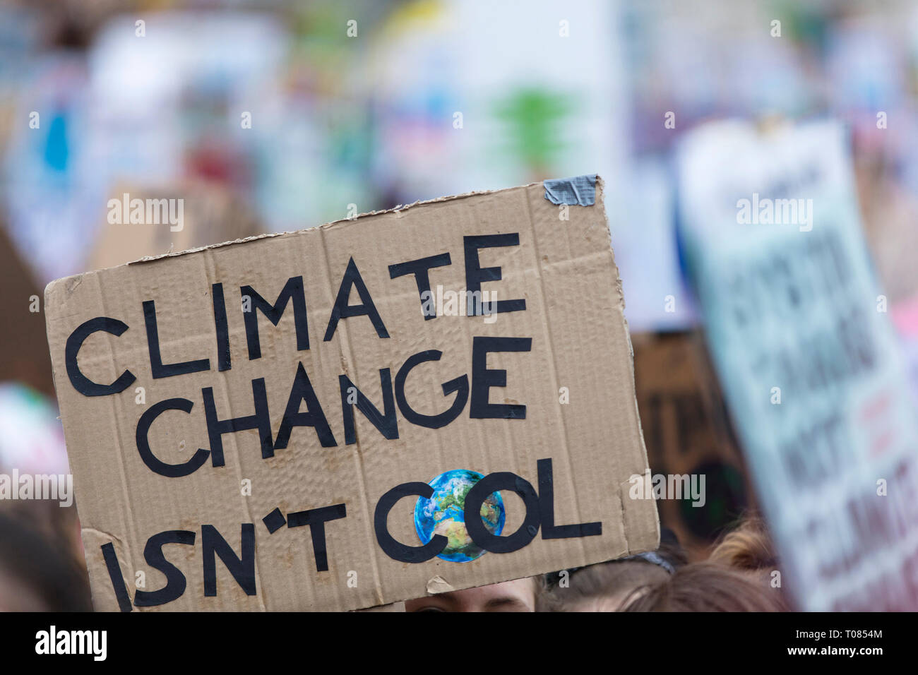 People with banners protest as part of a climate change march Stock ...