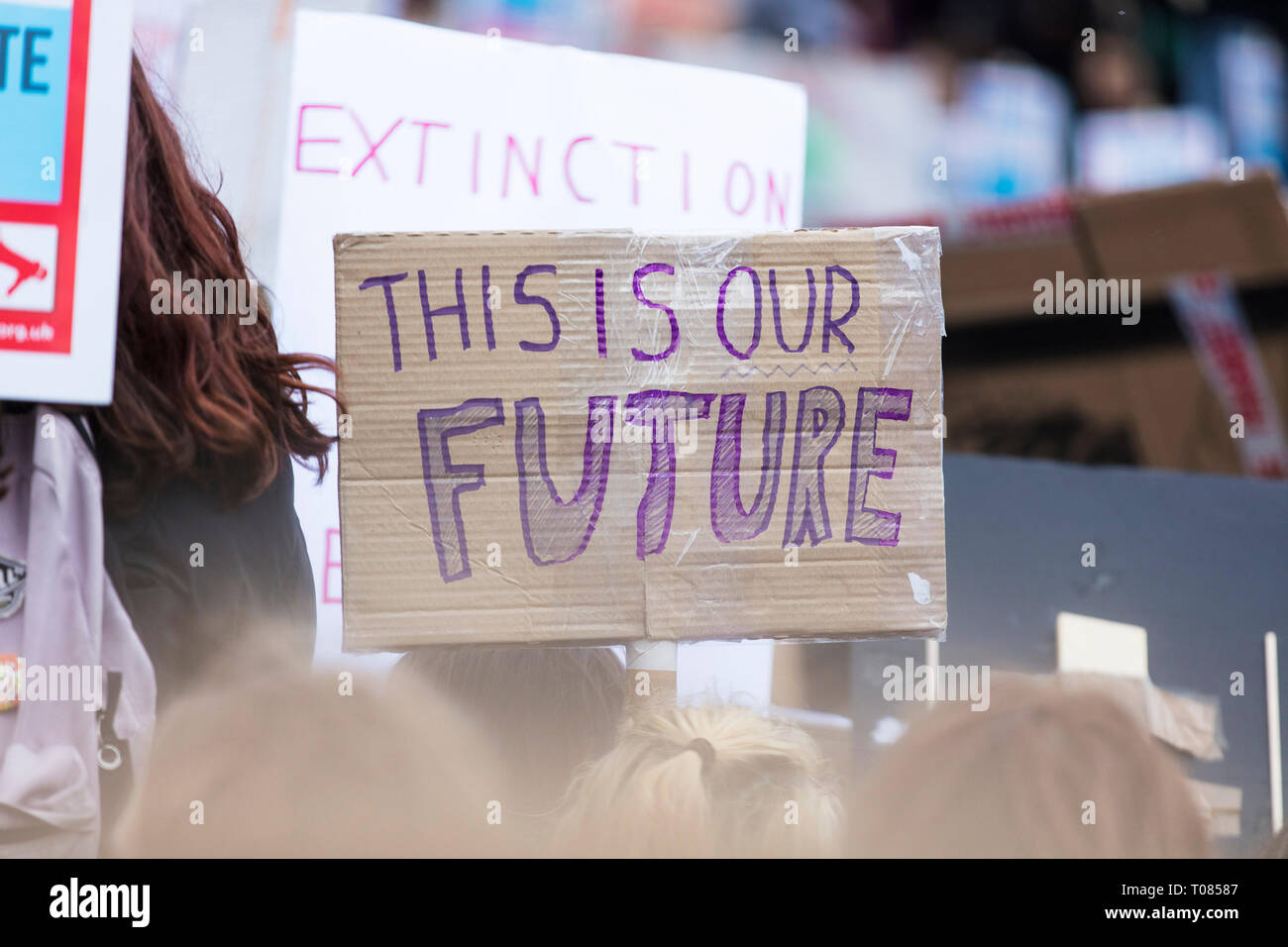 People with banners protest as part of a climate change march Stock ...