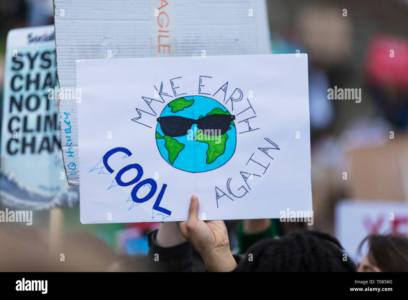 People with banners protest as part of a climate change march Stock ...