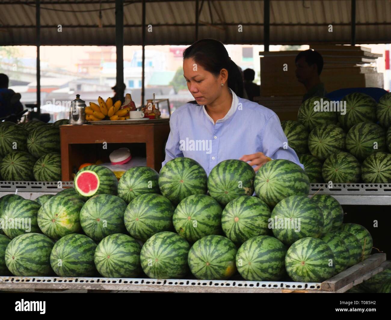 CAN THO, VIETNAM--MARCH 2018: A water melon vendor stands in front of ...