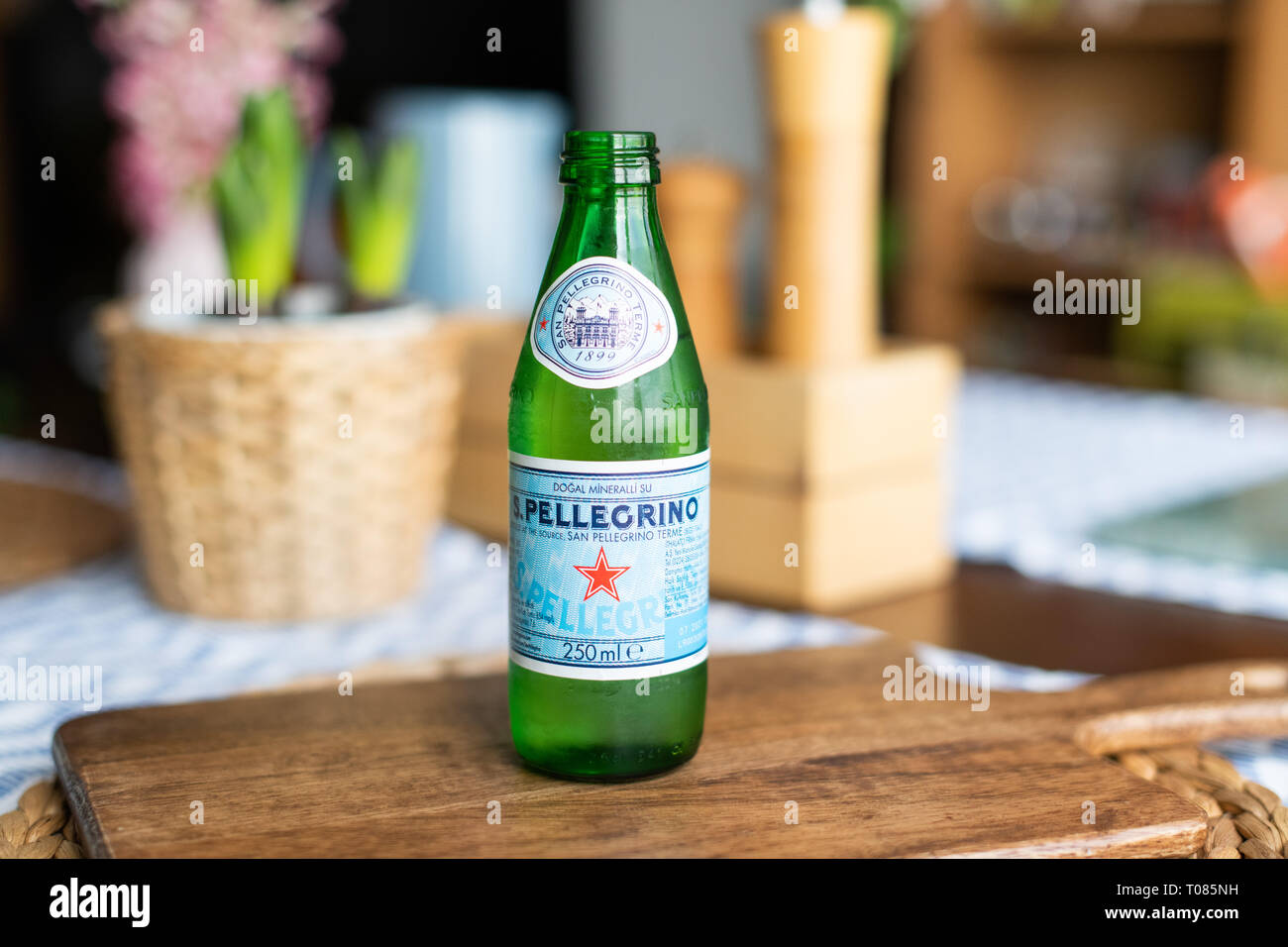 editorial - 250ml Glass San Pellegrino natural sparkling water bottle on a table with natural ...