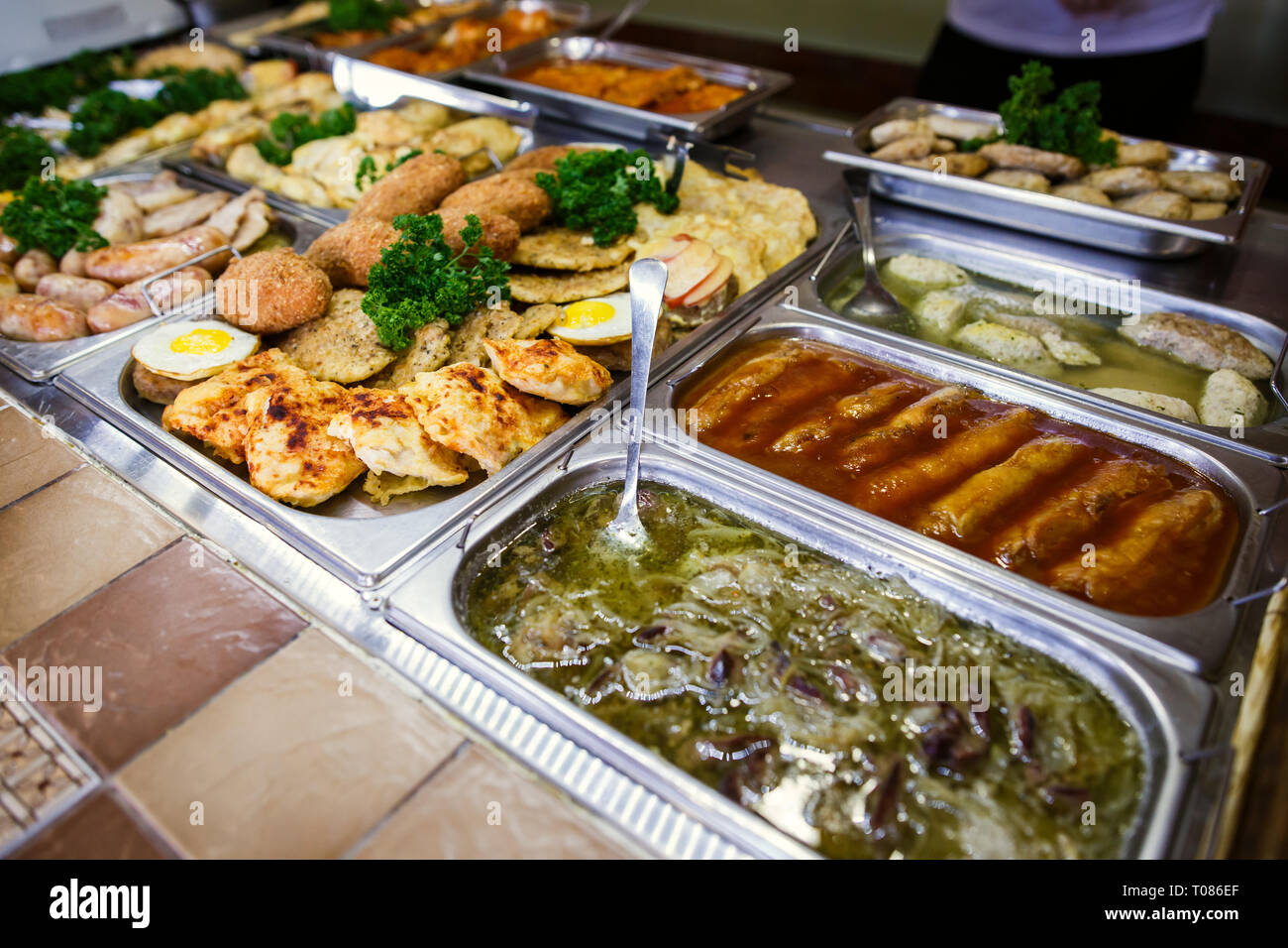 A set of meat dishes in the trays, a banquet table Stock Photo - Alamy