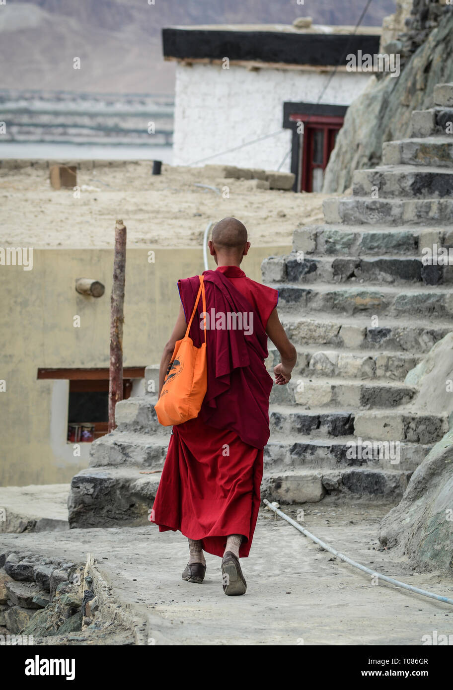 A monk at ancient Tibetan temple on top of mountain in Leh, India Stock ...