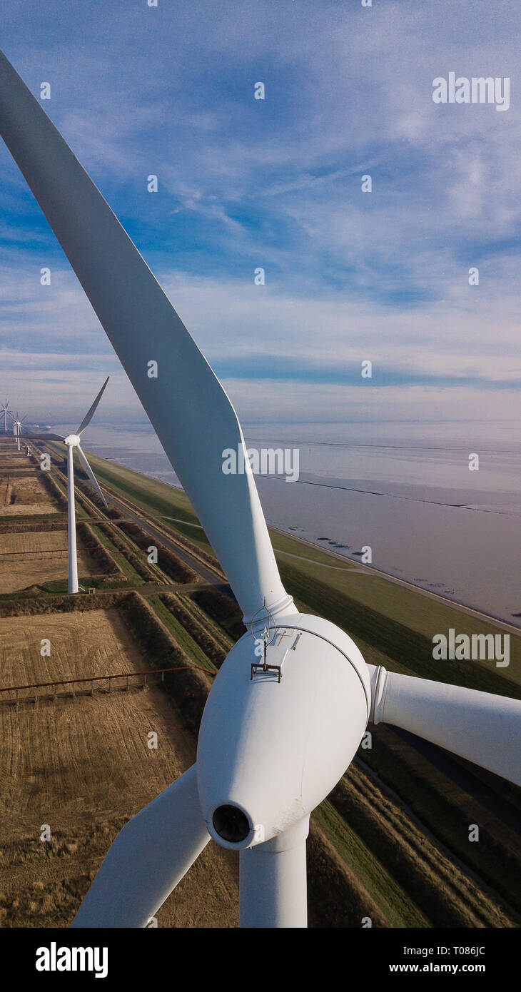 Close to the turbine. Wind turbine from aerial view - Sustainable ...