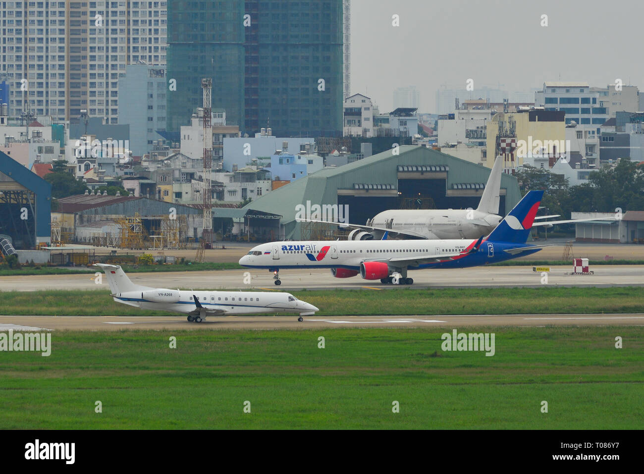 Saigon, Vietnam - Nov 18, 2018. Passenger airplanes taxiing on runway ...