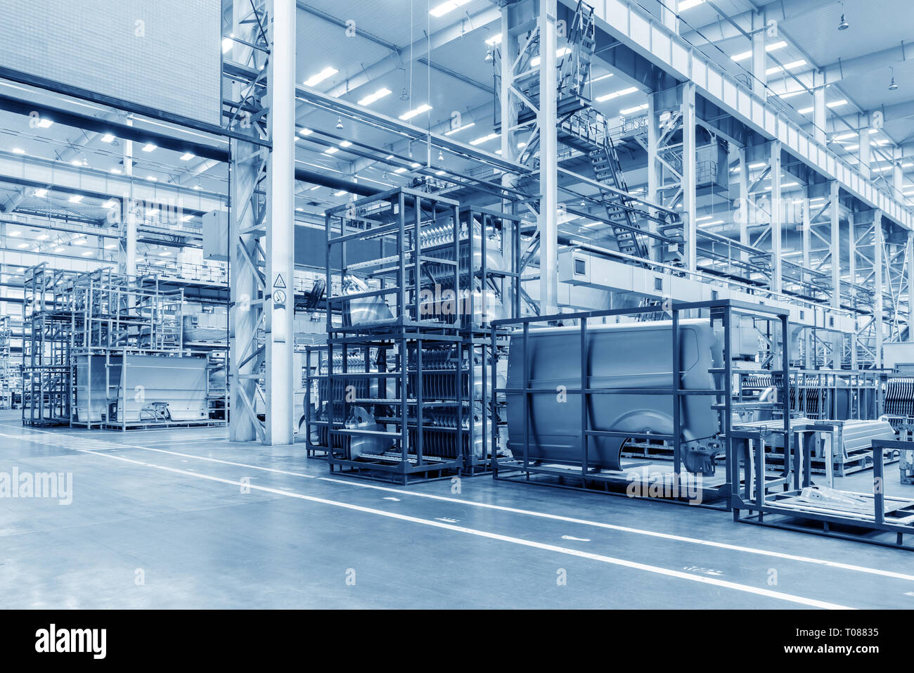 The interior of a big industrial building or factory with steel ...