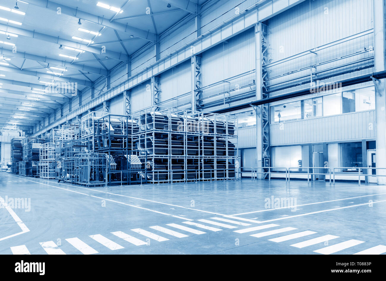 The interior of a big industrial building or factory with steel ...