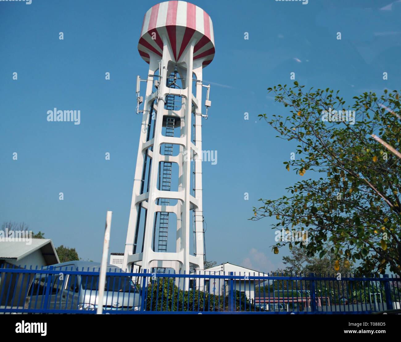 CHIANG MAI, THAILAND —MARCH 2018: Water tank along the road near the ...