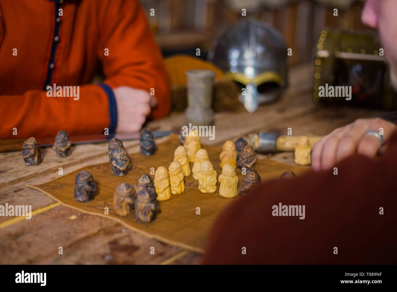 Two men in russian ethnic suit playing medieval popular strategy board ...