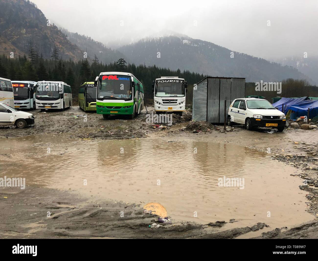 MANALI, HIMACHAL PRADESH—MARCH 2018: Transportation buses park in a ...