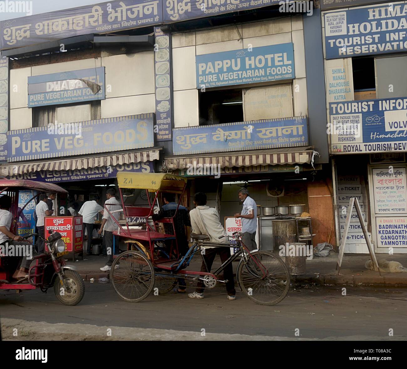NEW DELHI, INDIA—MARCH 2018: Cycle rickshaw drivers wait for passengers ...
