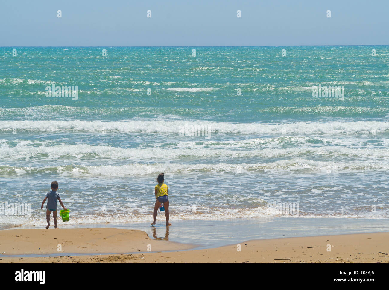 Two children playing waves hi-res stock photography and images - Alamy