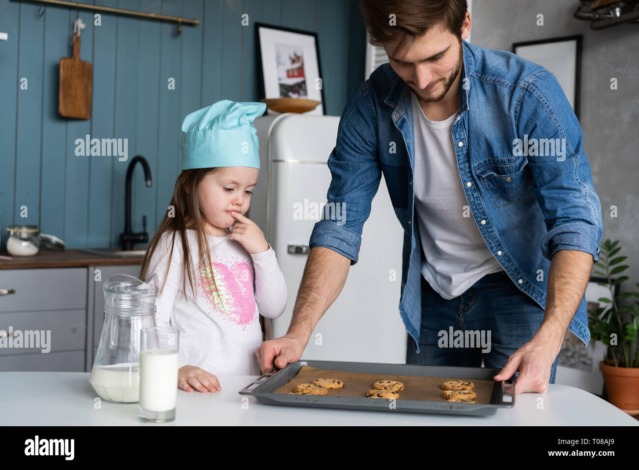 father and daughter making cookies in kitchen Stock Photo - Alamy