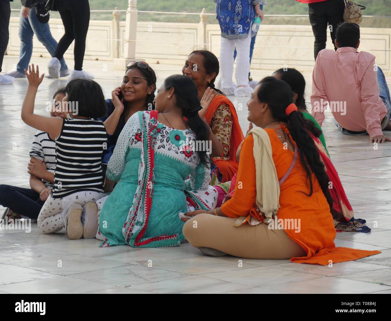 AGRA, UTTAR PRADESH, INDIA--MARCH 2018: A group of women and children ...