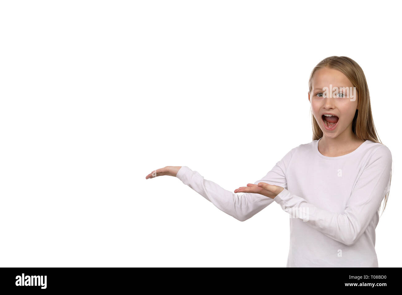 Young girl looks excited and points in one direction Stock Photo - Alamy