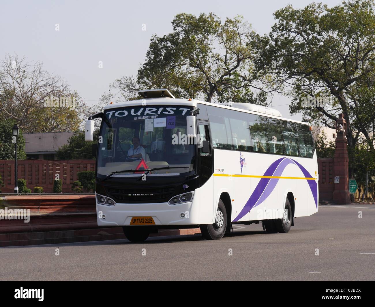 NEW DELHI, INDIA—MARCH 2018: A tourist bus drives around the road in ...