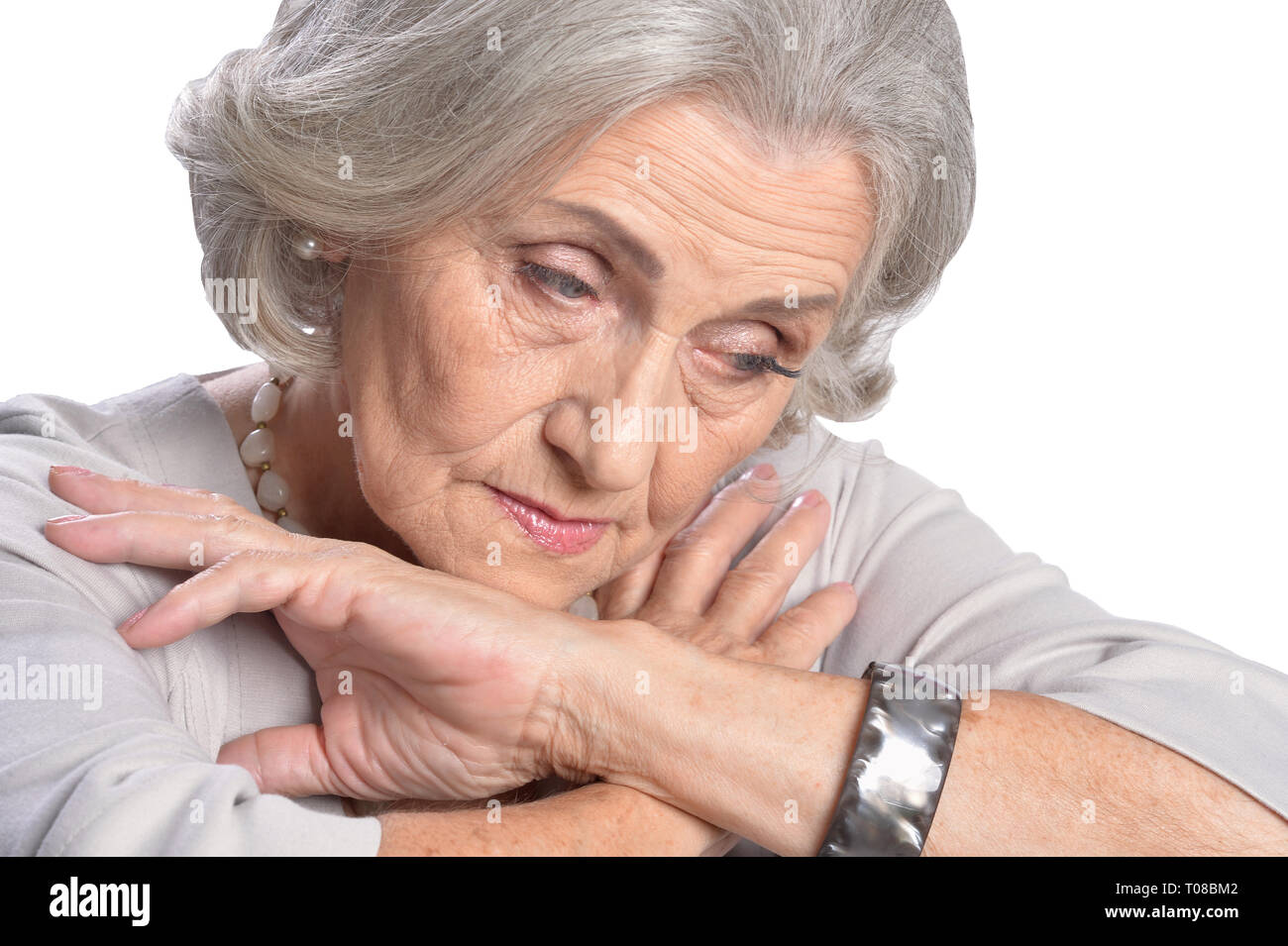 Portrait of sad senior woman on white background Stock Photo - Alamy