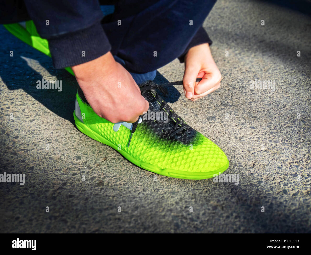 Boy tying shoe lace Stock Photo - Alamy