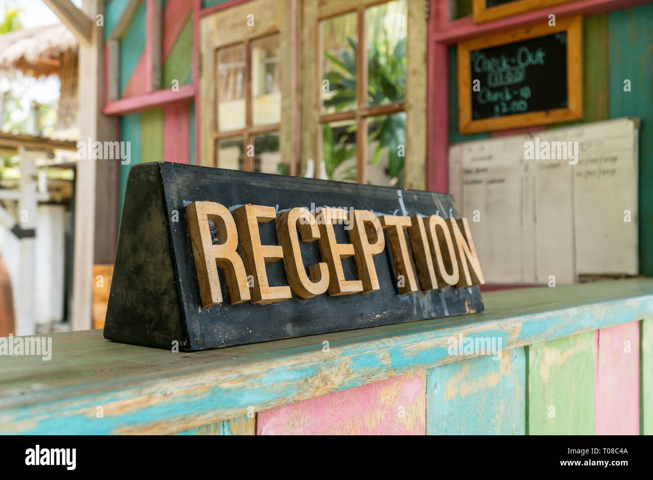 Close up of wooden reception desk in a low budget motel. Tourism and ...