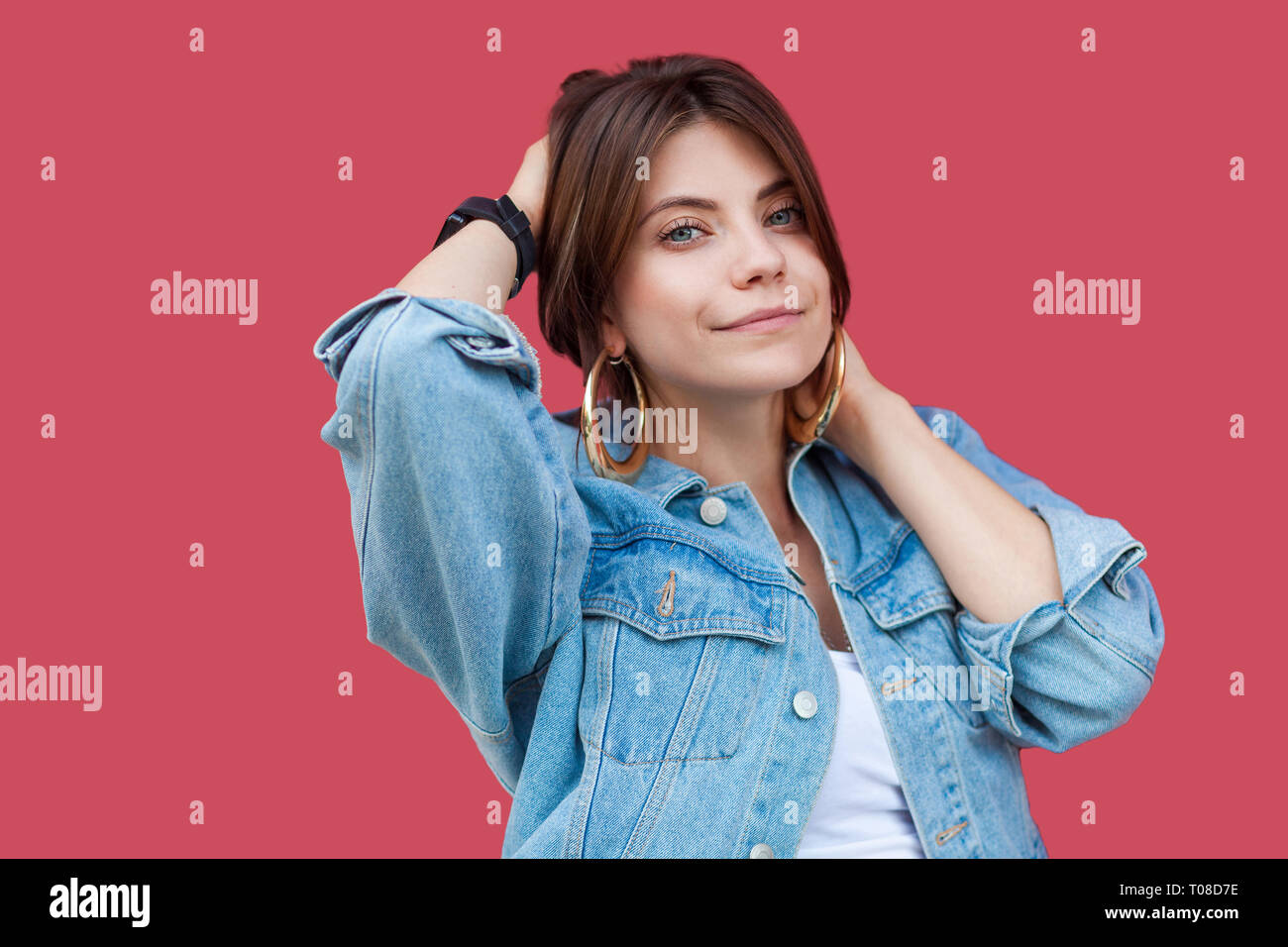 Portrait of fancy beautiful brunette young woman with makeup in denim ...