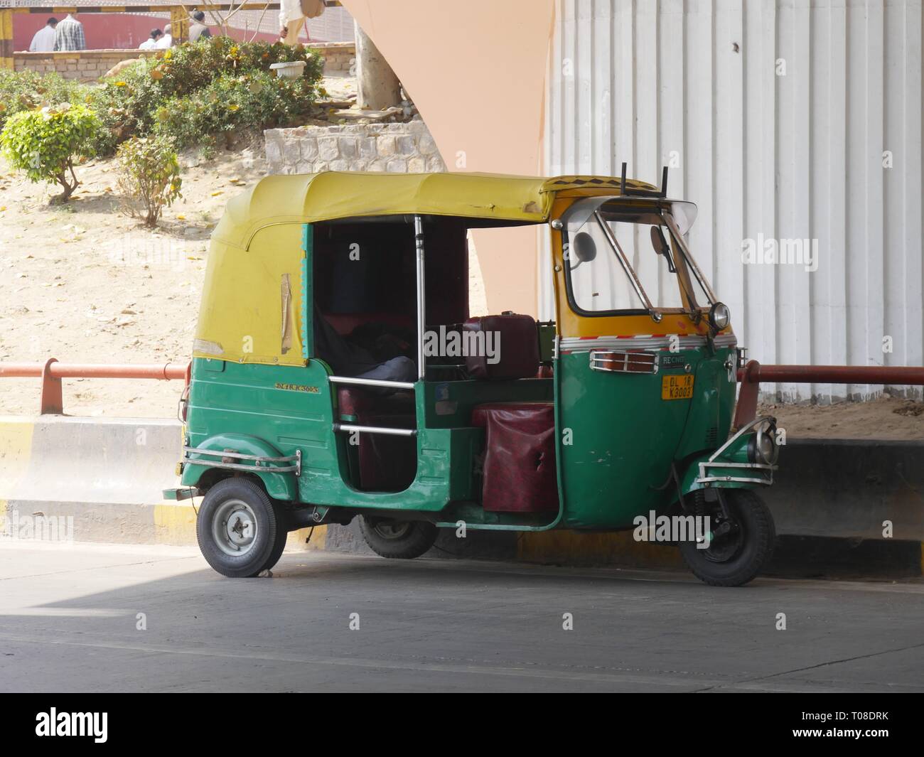 NEW DELHI, INDIA—MARCH 2018: An auto rickshaw waits by the side of the ...