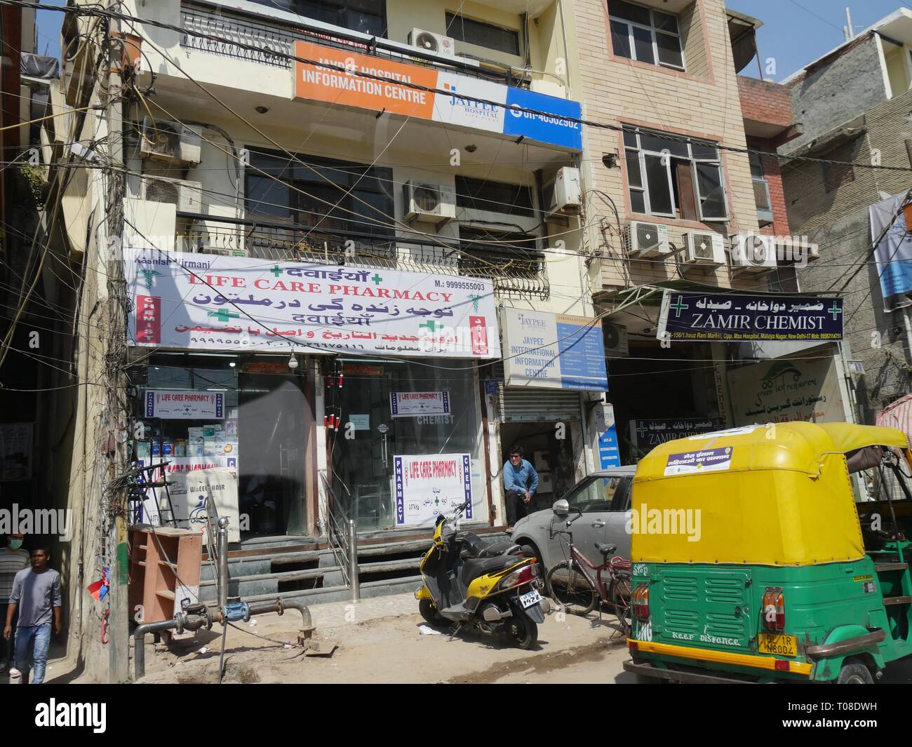 NEW DELHI, INDIA—MARCH 2018: Typical road side scene with buildings and ...
