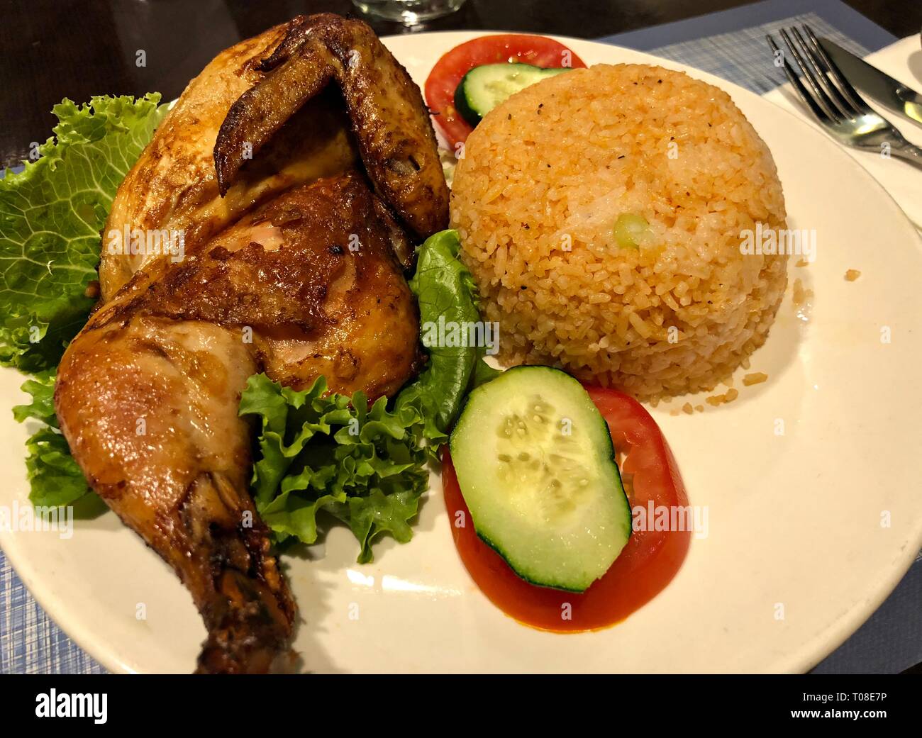 Delicious fried chicken dish with fried rice and vegetables Stock Photo ...
