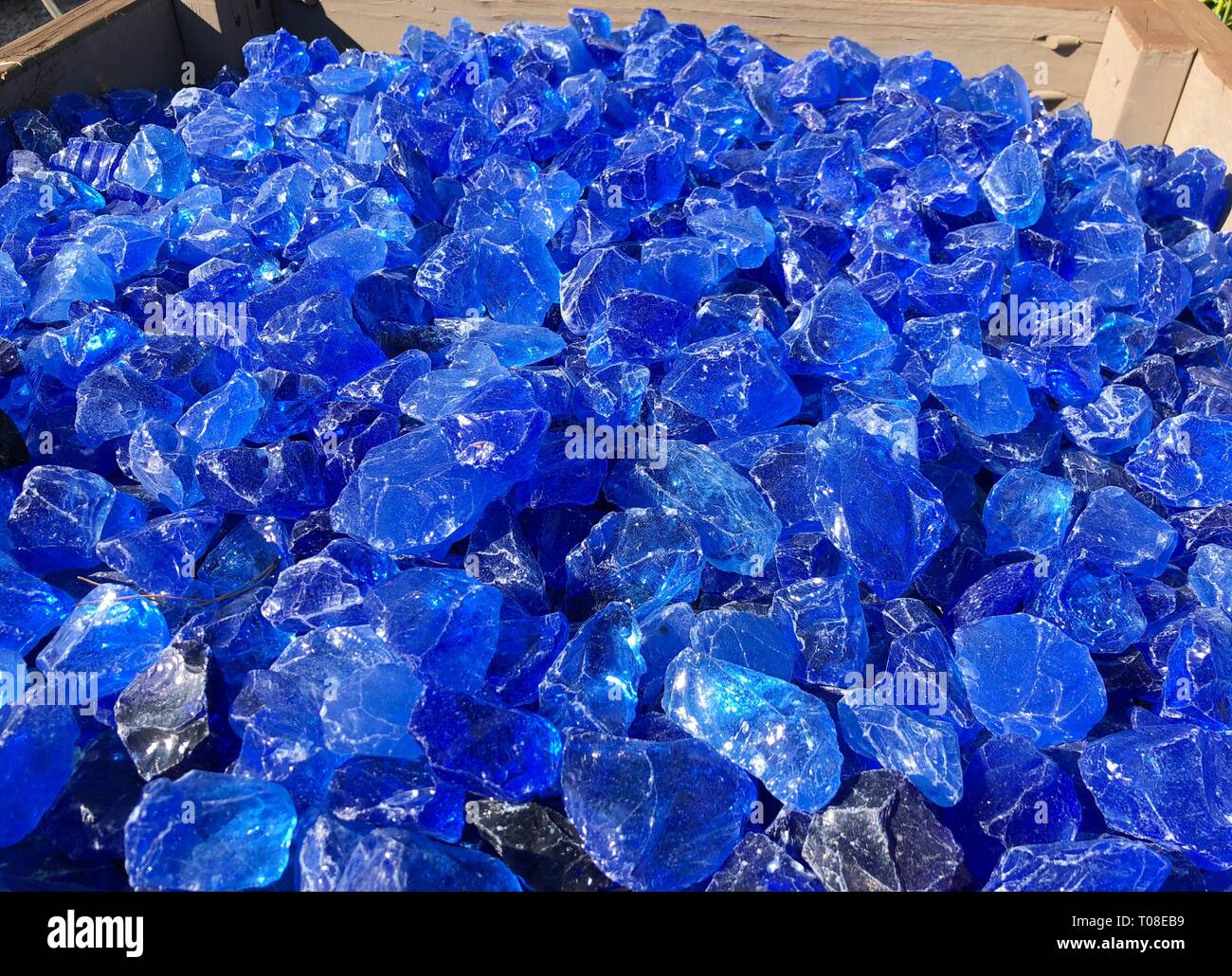 Medium close up of a pile of blue rock gemstones in a crate Stock Photo ...