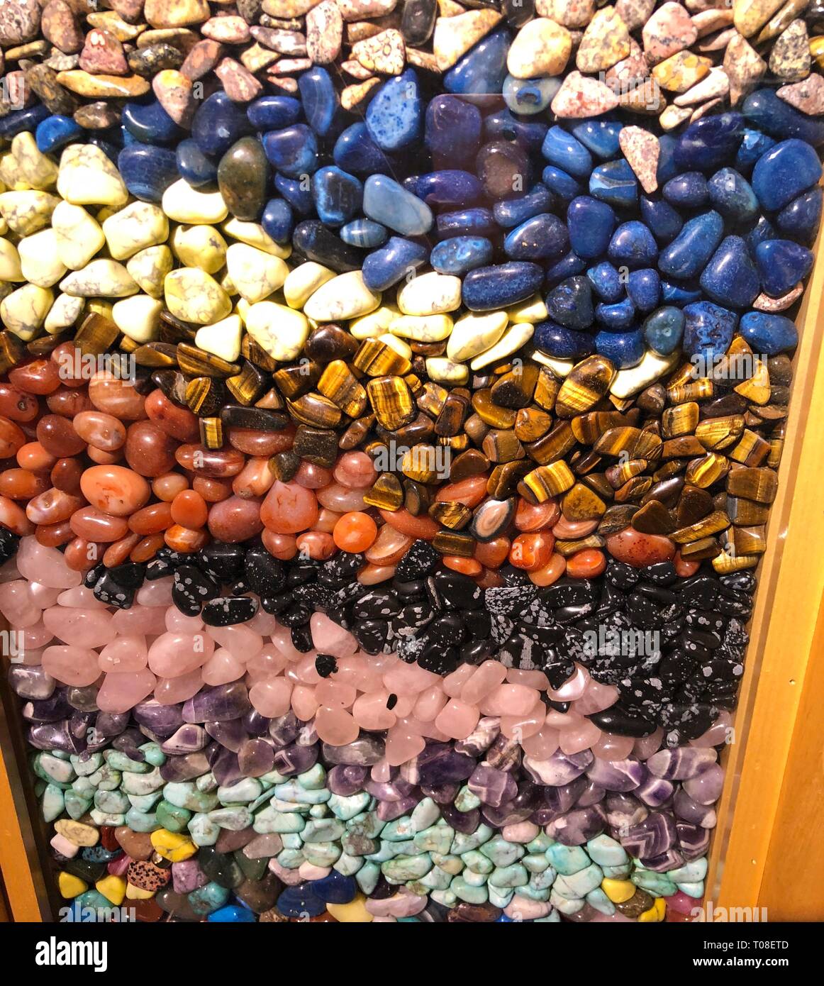 Wide shot of an assortment of colorful gemstones Stock Photo - Alamy
