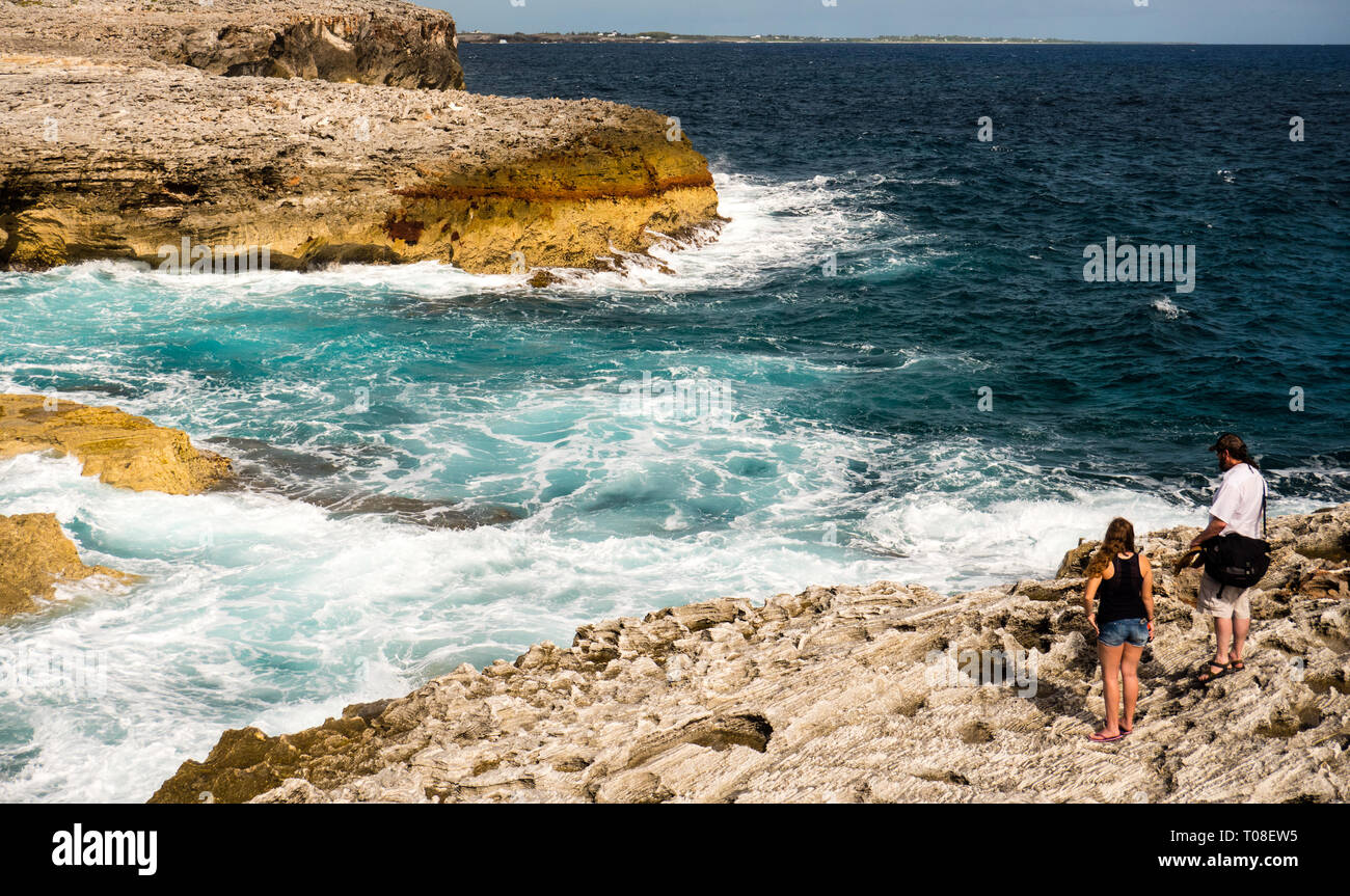 Two Tourists Watching, Waves Crashing on Limestone Cliffs,The Queens ...