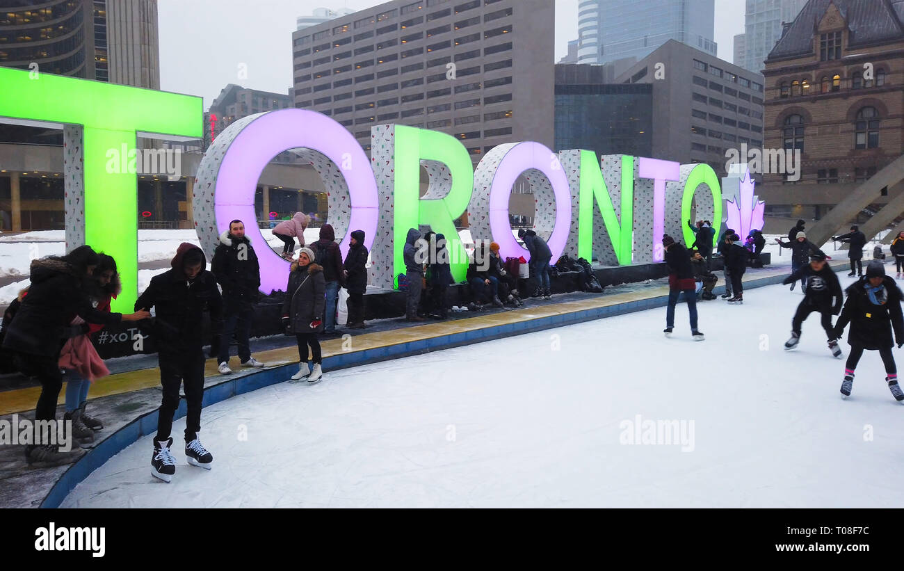 People ice skating on Toronto's famous ice rink at Nathan Phillips ...