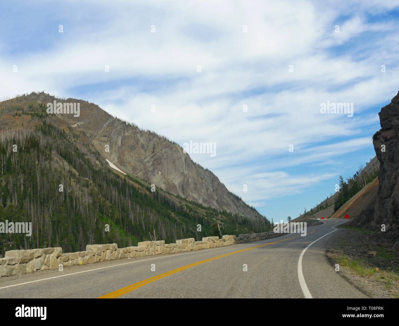 Upward paved road with rocky hills and beautiful clouds Stock Photo - Alamy