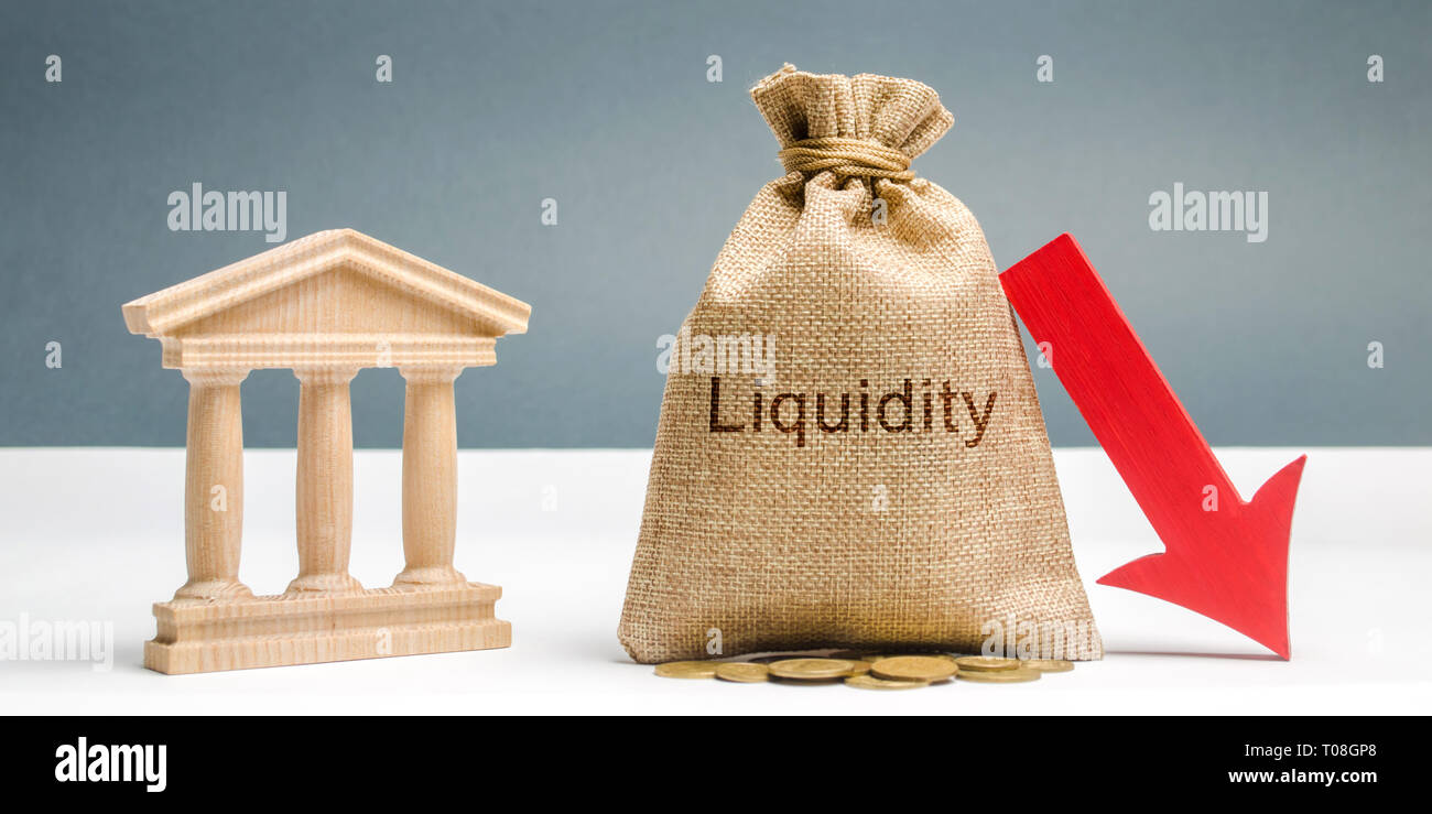 Money bag with the word Liquidity, down arrow and bank building. The ...