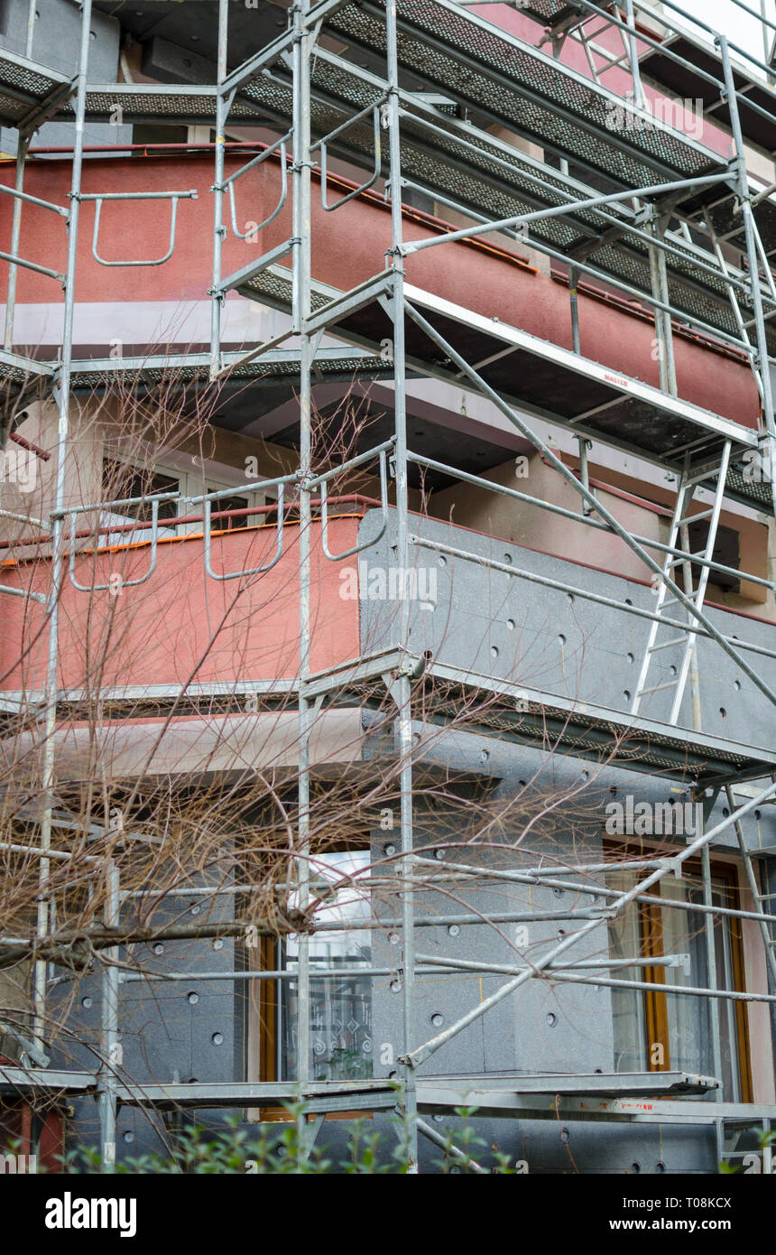 Building under reconstruction. wall insulation. metal structures for ...