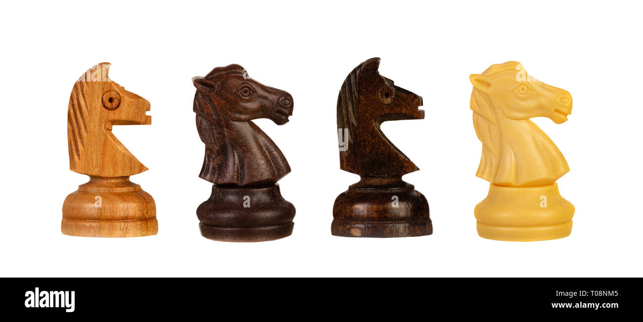 Four different chess knights isolated on a white background Stock Photo ...
