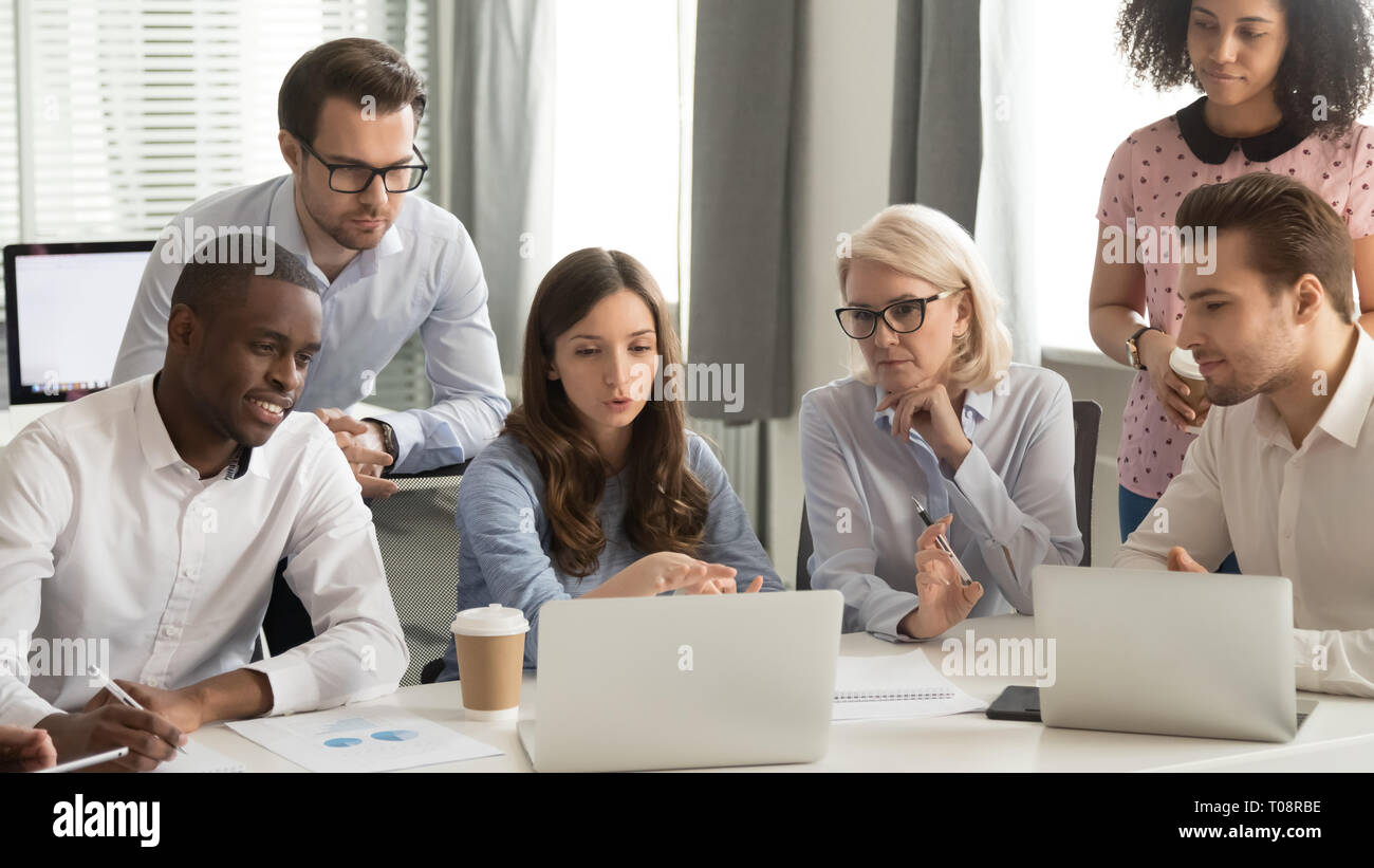 Group business colleagues looking laptop hi-res stock photography and ...