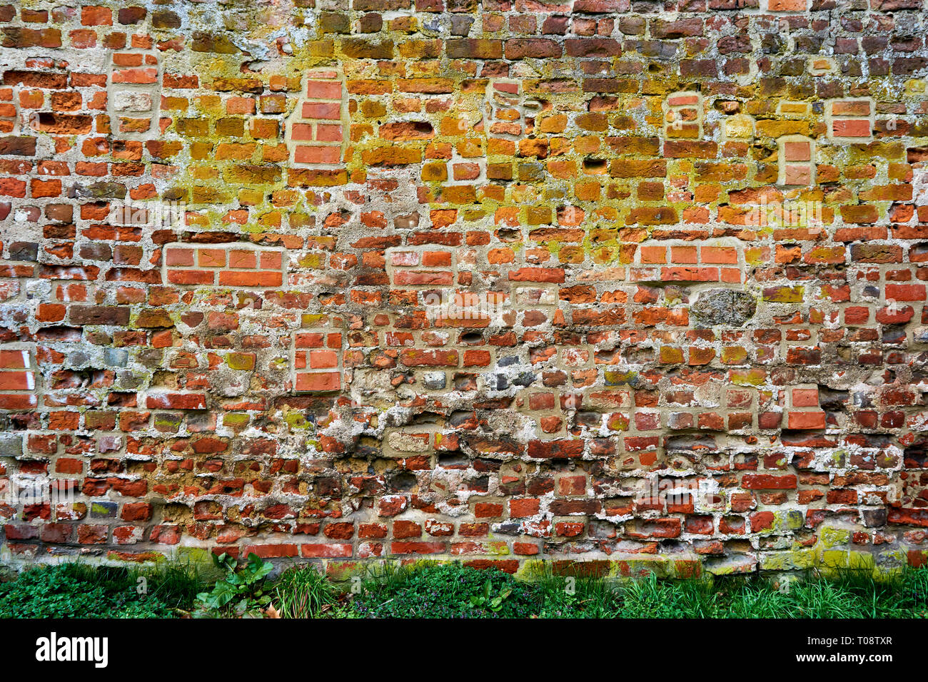 old repaired wall with brick texture Stock Photo - Alamy