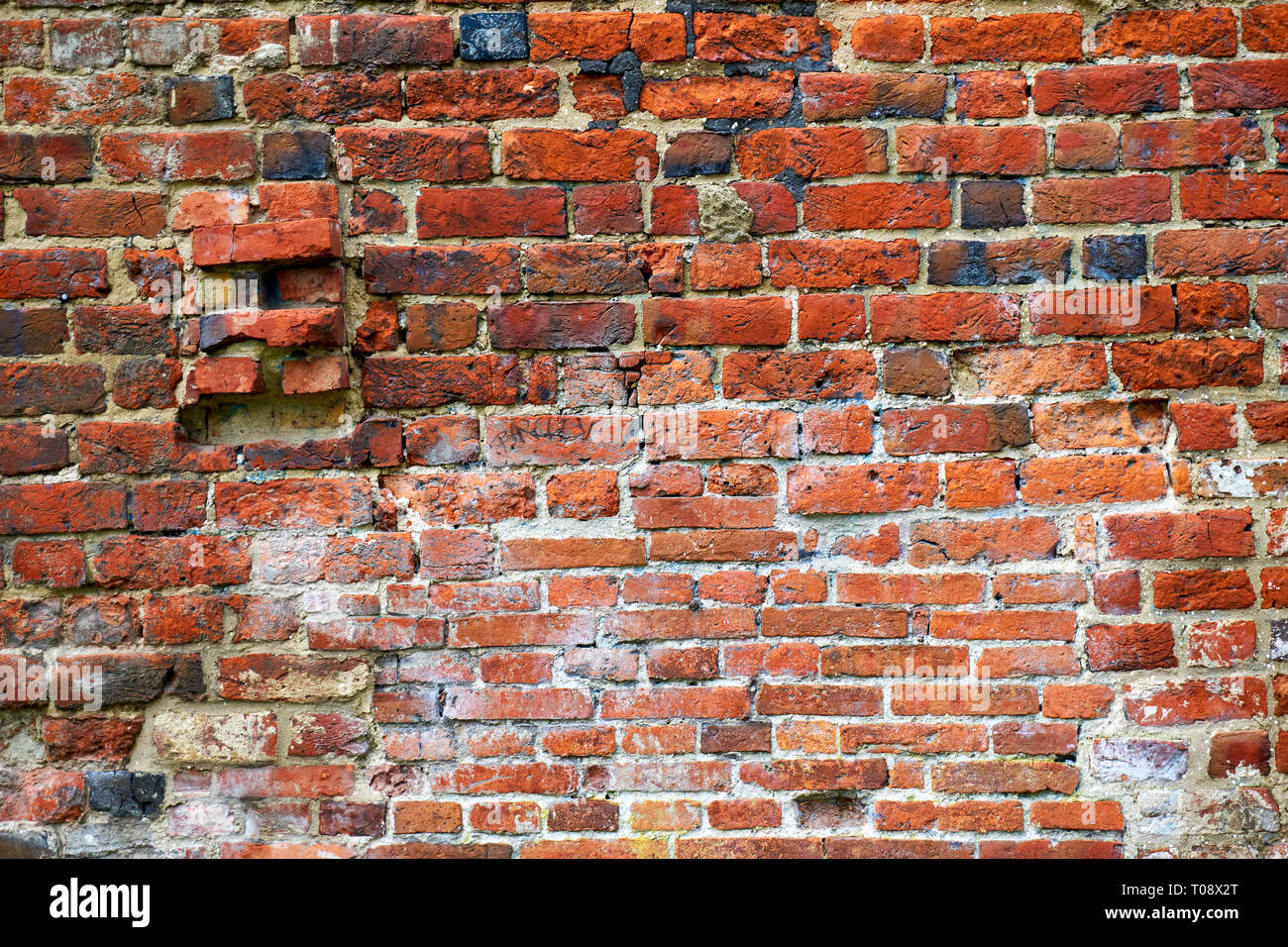 old repaired wall with brick texture Stock Photo - Alamy