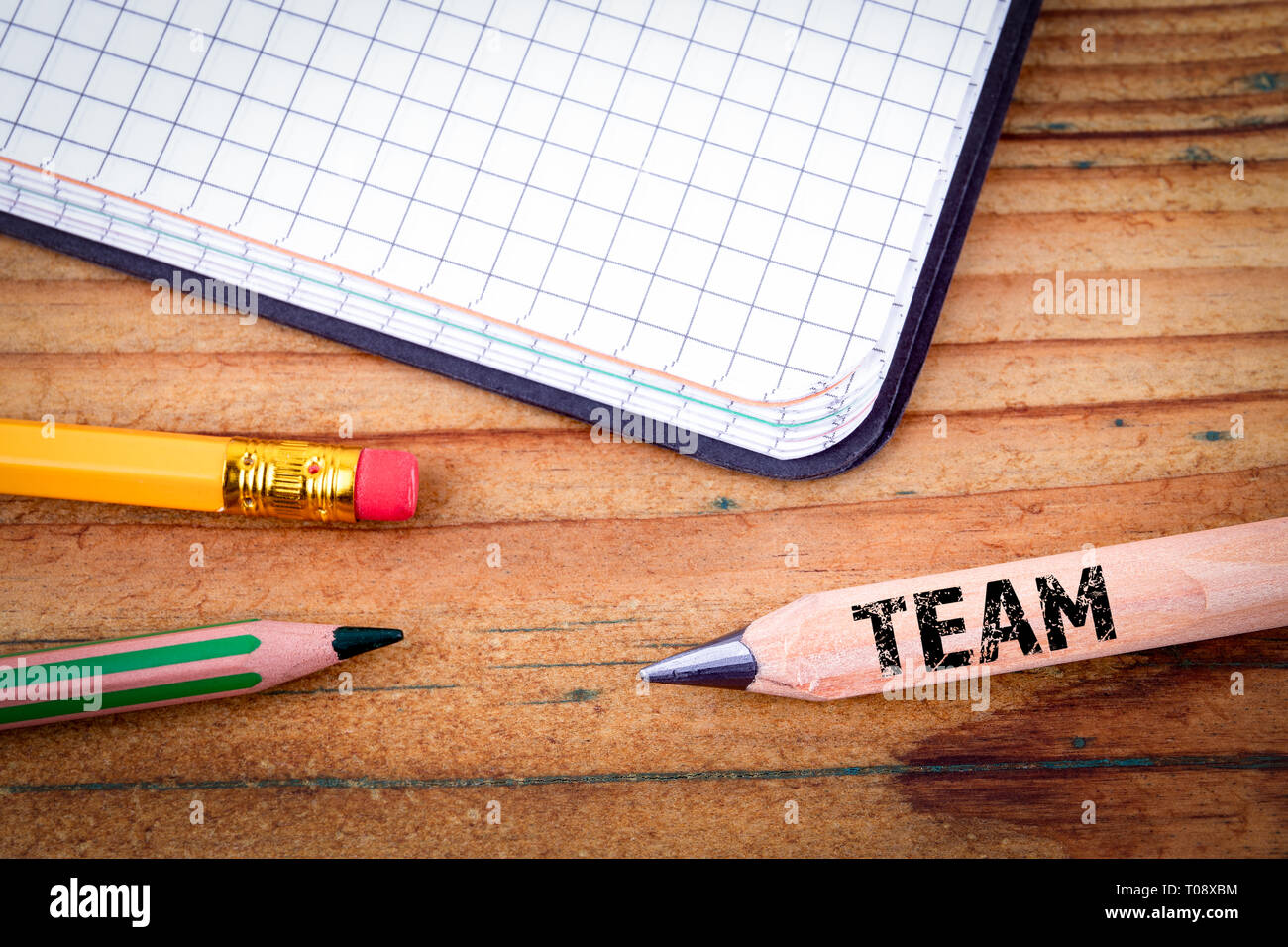 Team text on pencil. Business success concept Stock Photo - Alamy