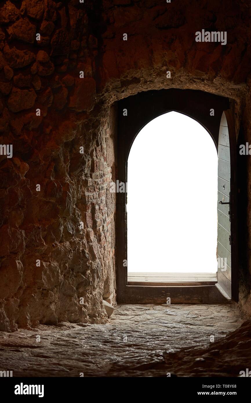 Passage of an old castle, open door Stock Photo - Alamy