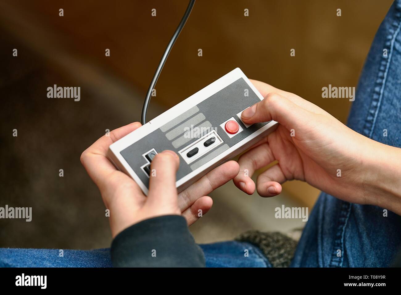Playing an old gaming console Stock Photo - Alamy